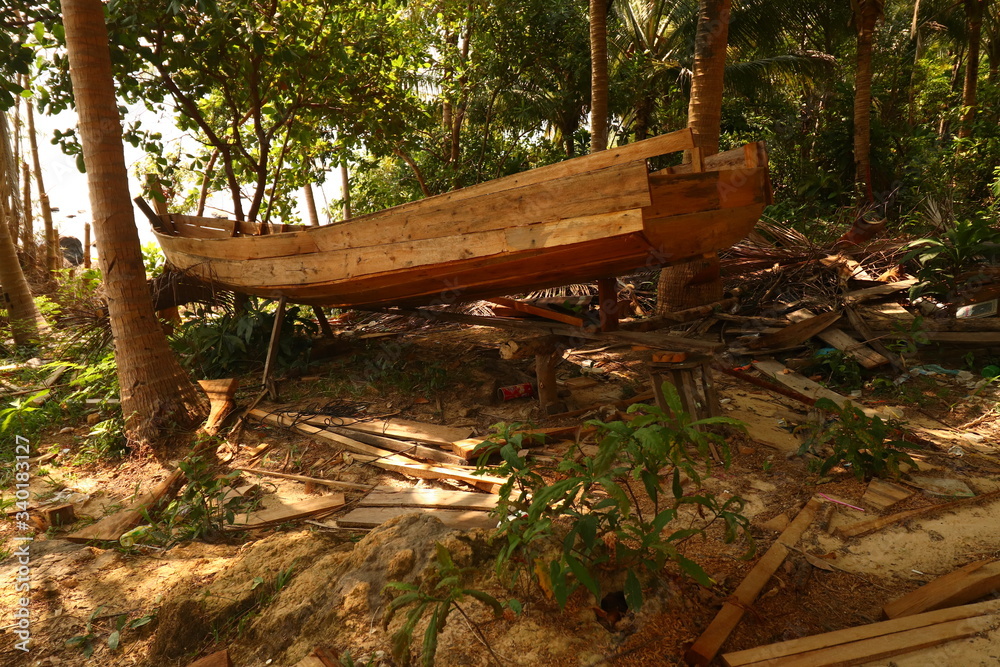 A traditional Cambodian or Khmer boat called Bon Om Touk being repaired ...