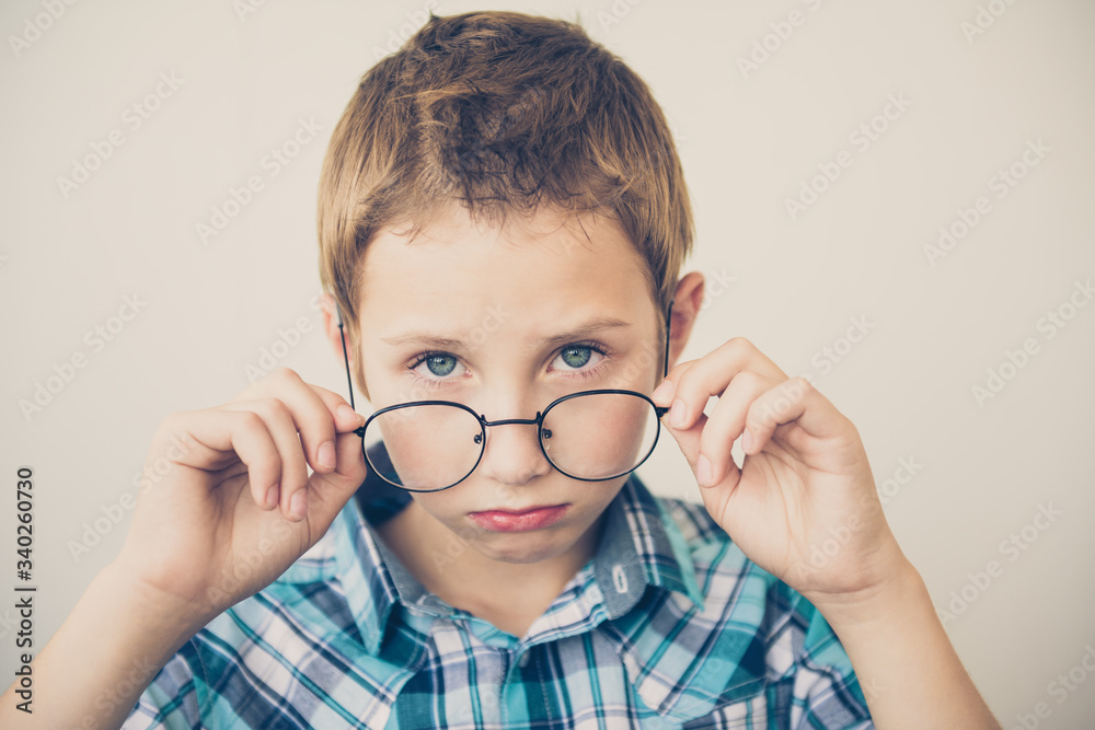 Handsome boy trying on big glasses. The concept of myopia, vision ...