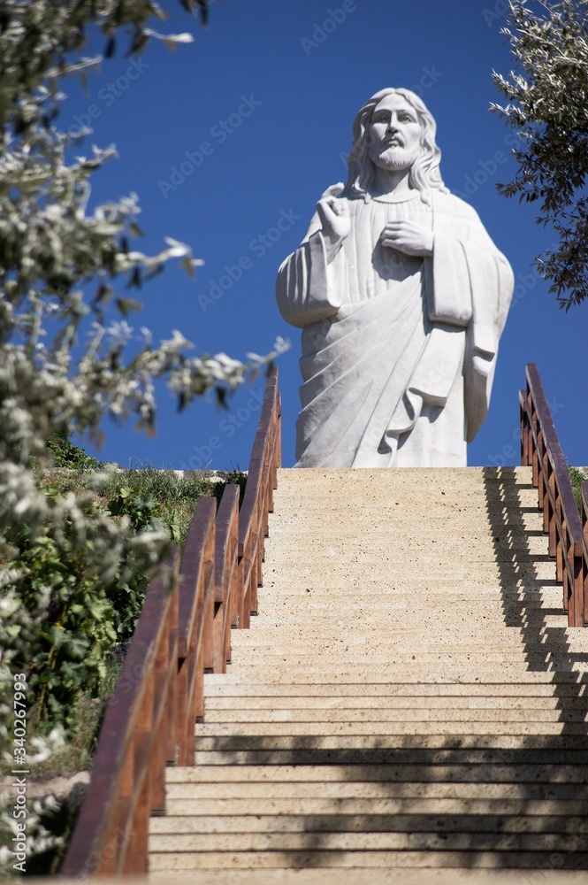 Jesus statue, bottom view. Stairs leading to the monument and growing ...