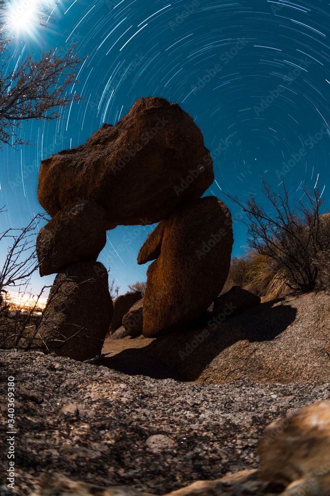 Star Trails behind a natural stone arch structure Stock Photo | Adobe Stock
