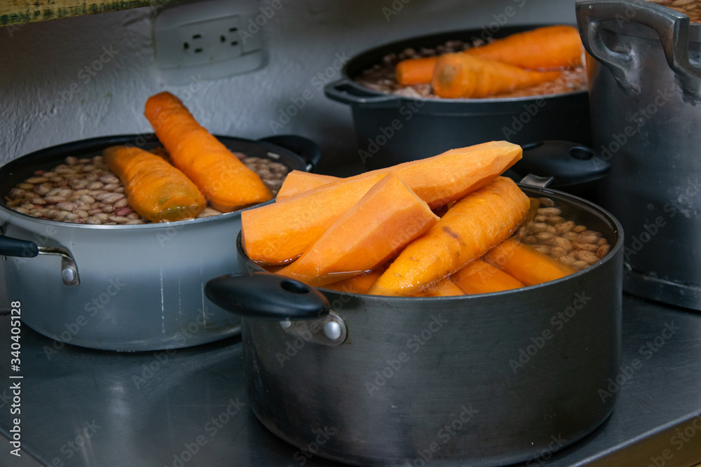 Daucus carota beans and beans. Beans and carrot grains in water. Brown ...