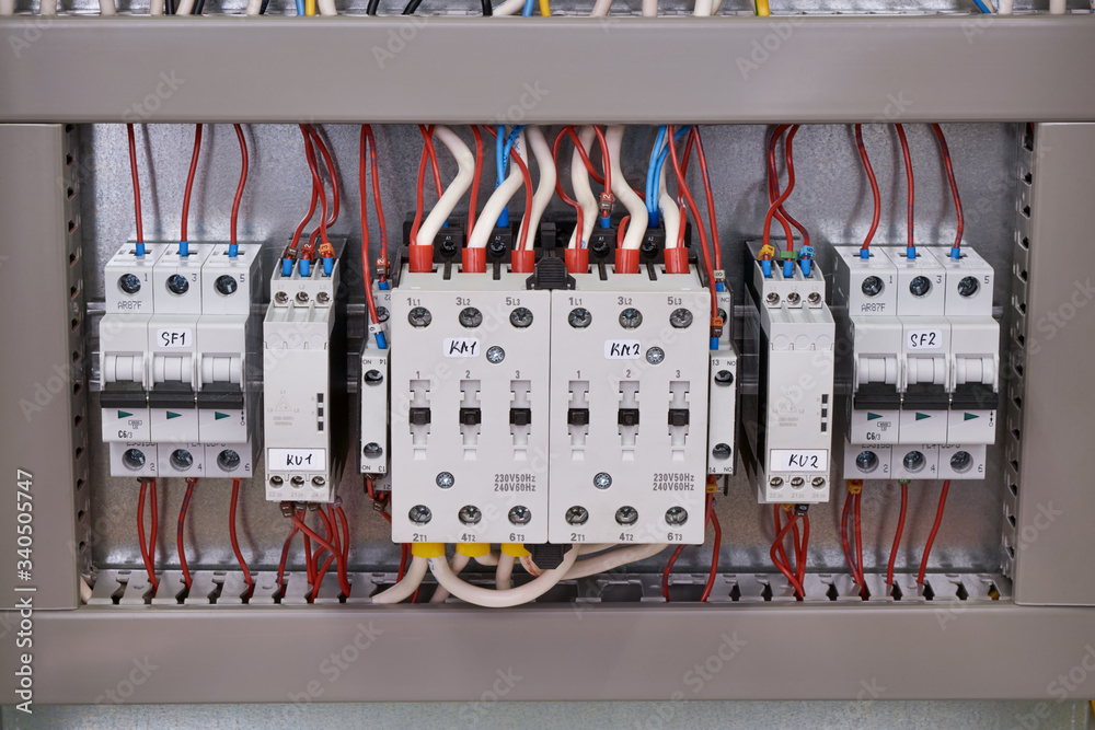 Two contactors with mechanical interlocking between them, two phase ...