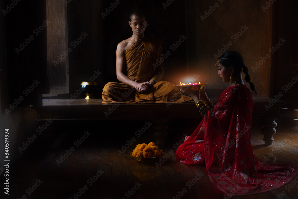 Girl wearing Indian clothes and monks in temple Stock Photo | Adobe Stock