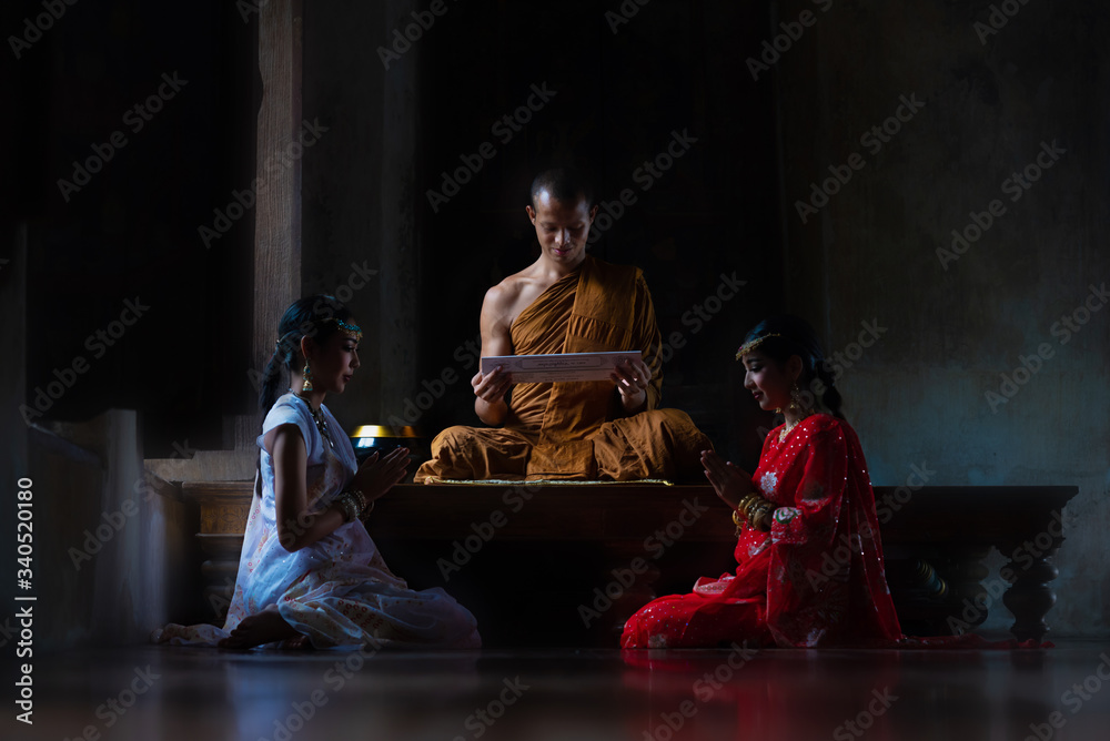 Girl wearing Indian clothes and monks in temple Stock Photo | Adobe Stock