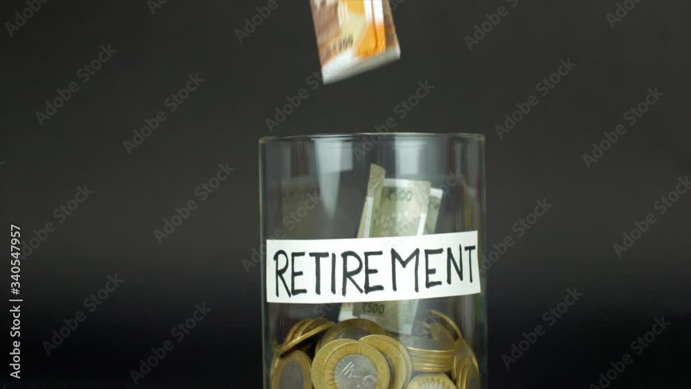 Woman hands dropping banknotes in a container with retirement label ...