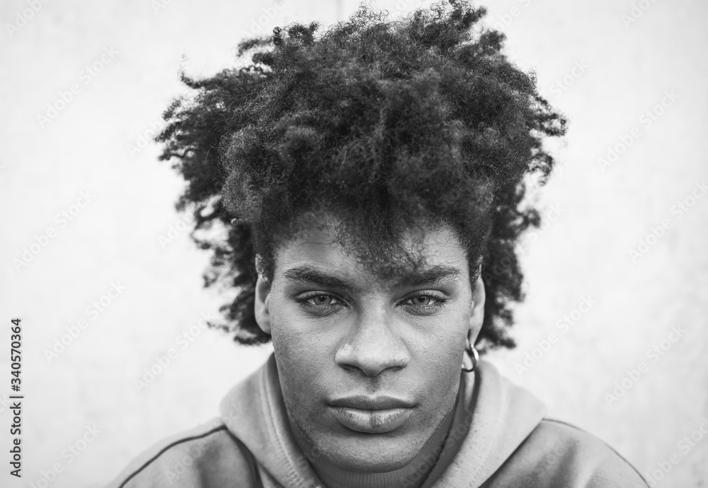 Mixed race young man portrait - African boy posing in front of camera ...