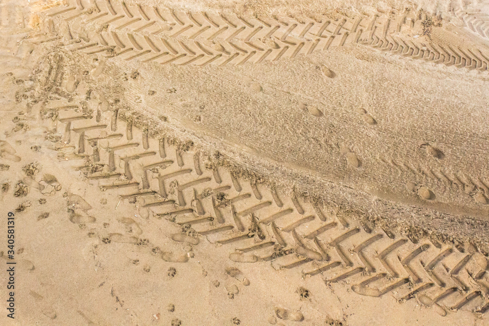 Tire tread on the sand. Wet sand on the beach. Background for ...