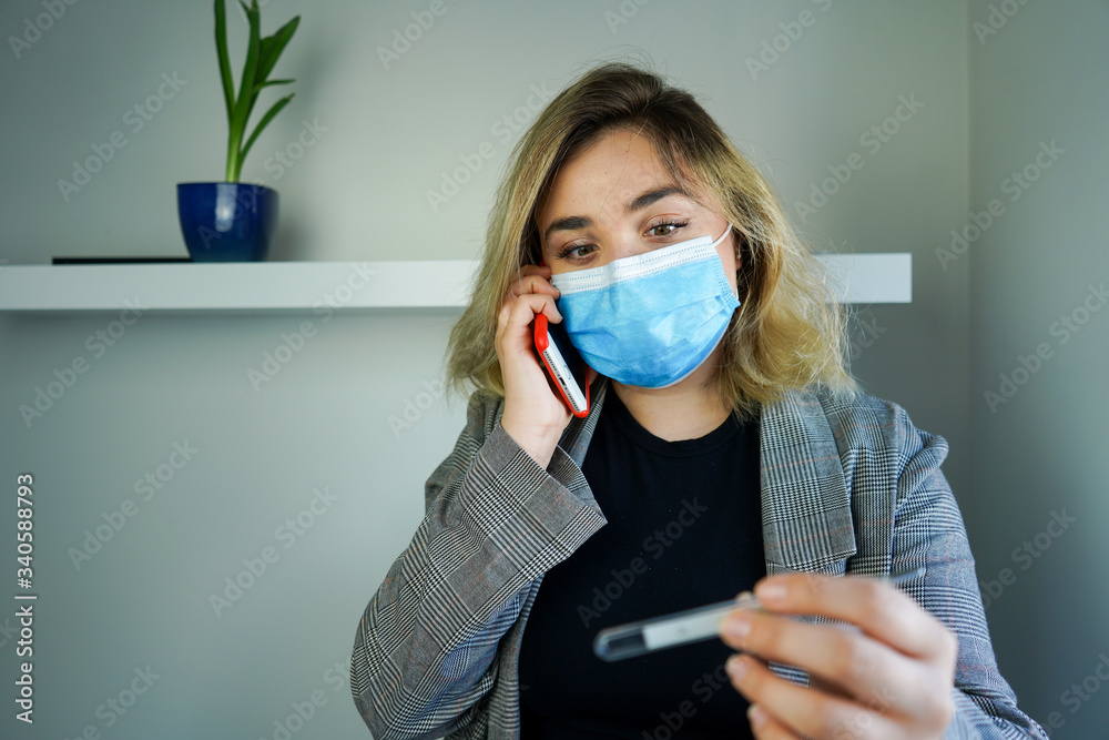 European woman checking high temperature with thermometer. Corona virus ...