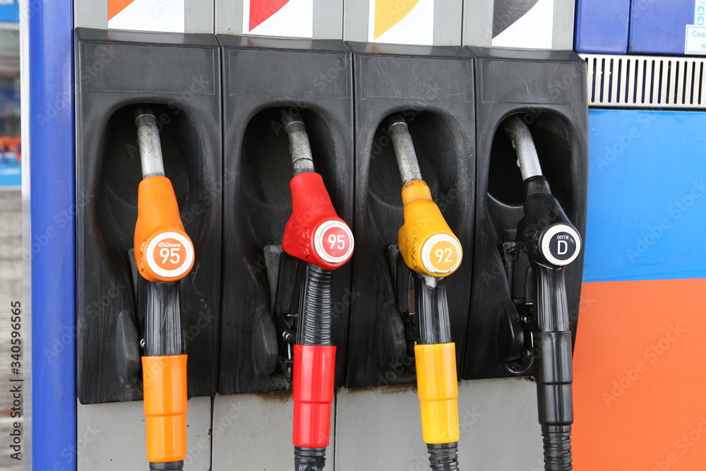 Gas station in car service. Colorful petrol pump filling nozzles ...