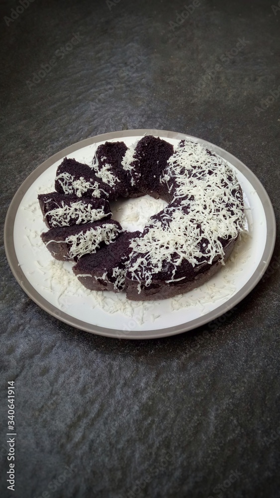 Black sticky rice cake with cheese topping Stock Photo | Adobe Stock