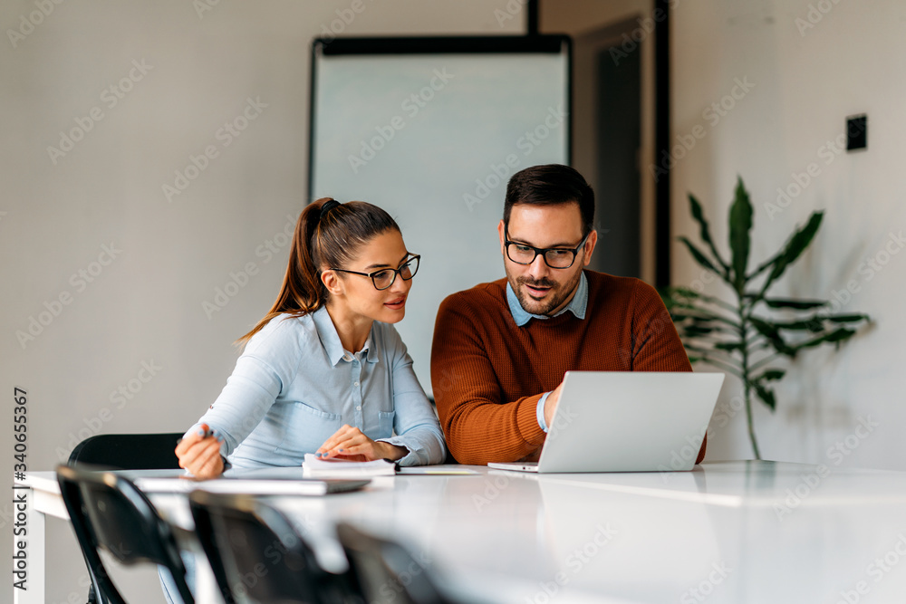 Coworkers working together in the office Stock Photo | Adobe Stock