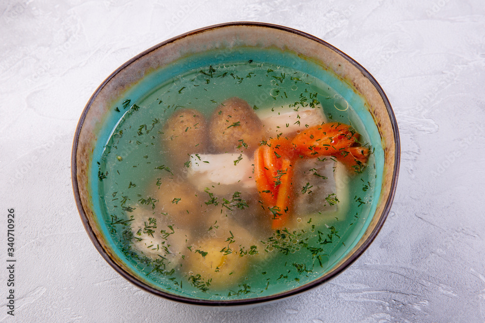 Sterlet and pike perch fillet fish soup, fish stock, potatoes, carrots ...