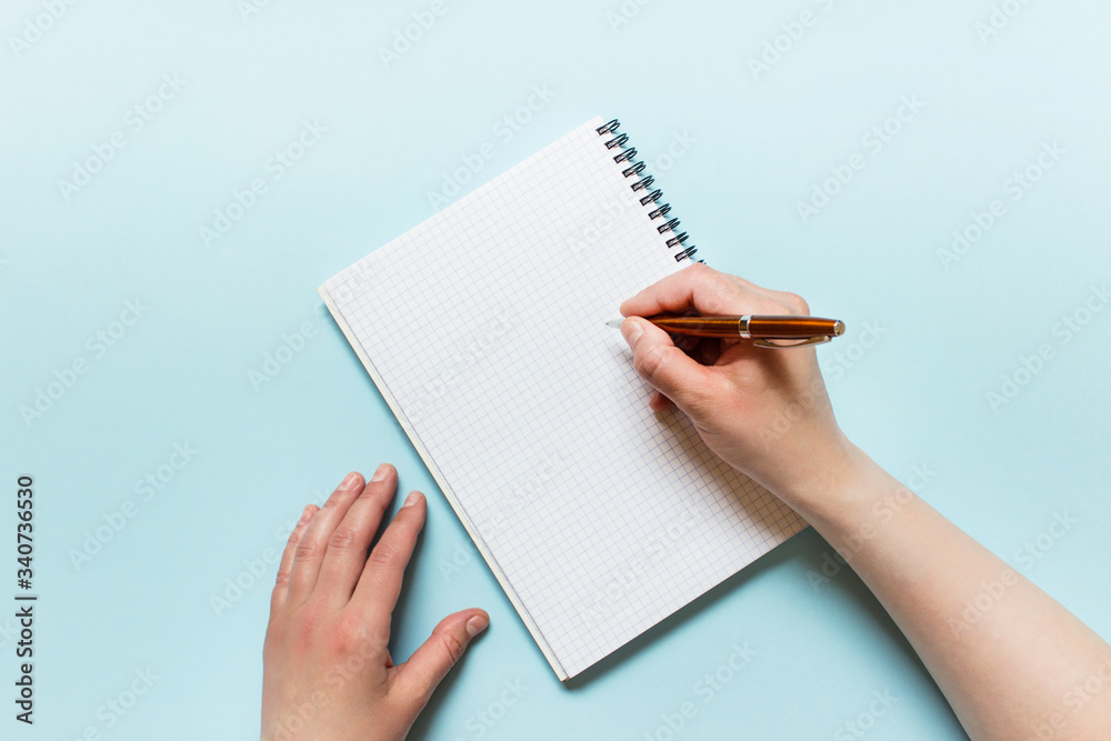 Top view mockup template with female hands writing with a Parker pen in ...