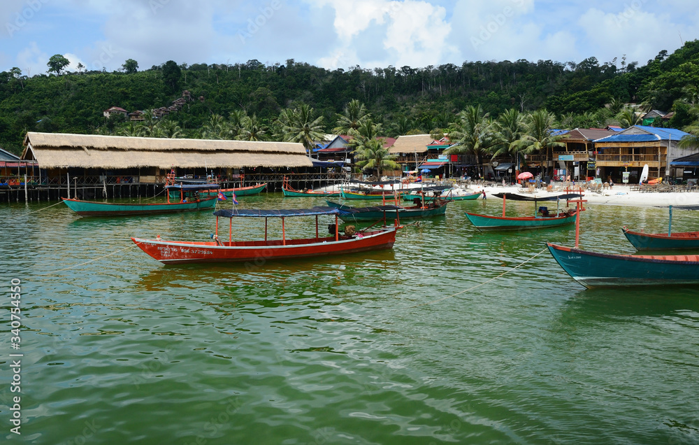 Foto de Village view with traditional khmer boats on the beach of Koh ...