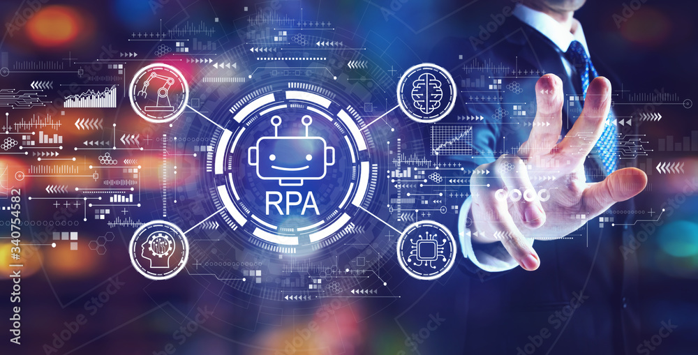Robotic process automation concept with businessman on night city ...