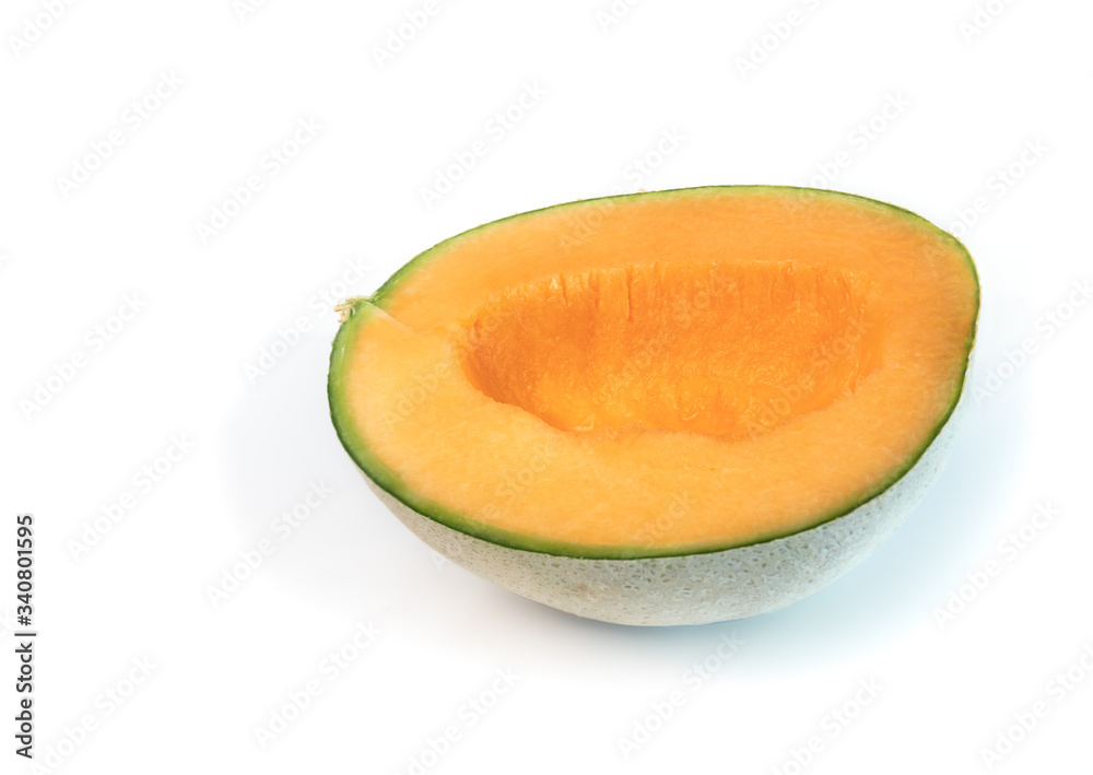 Cantaloupe melon cut in half with seeds scooped out. Also known as ...