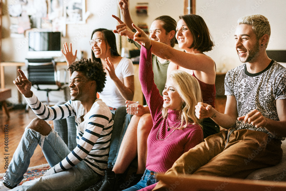 Friends cheering on their team Stock Photo | Adobe Stock