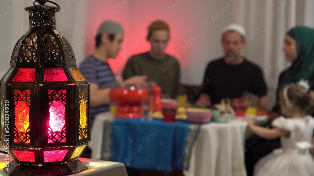 Fasting Muslim family during Ramadan. Breaking the fast. The Islamic ...