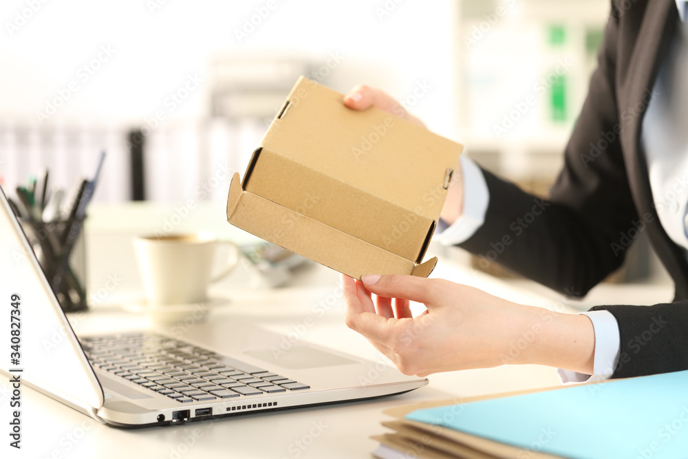 Business woman hands opens package at the office Stock Photo | Adobe Stock
