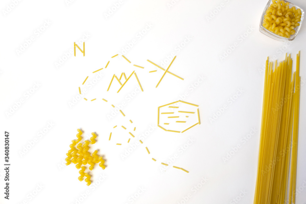 pasta treasure map with cross, with spaghetti and macaroni in bowl on ...