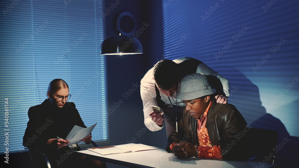 Detective uses force in questioning the accused black man while another ...