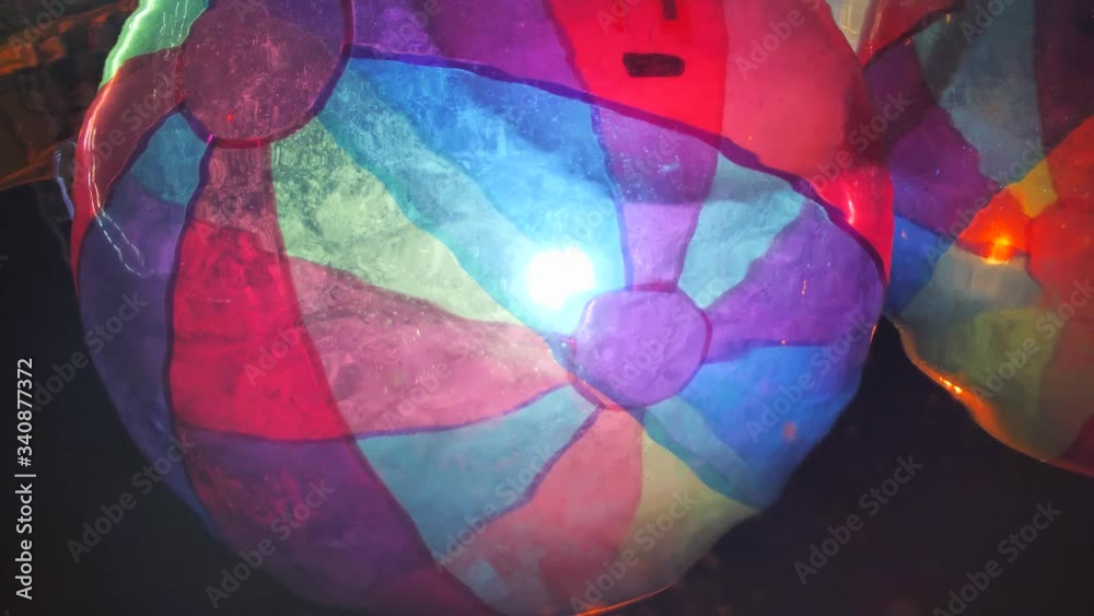 Big plastic bubbles on water for children. Zorbing in swimming pool ...