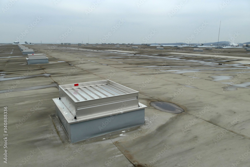 Large warehouse or distribution center flat roof with mounted fire ...