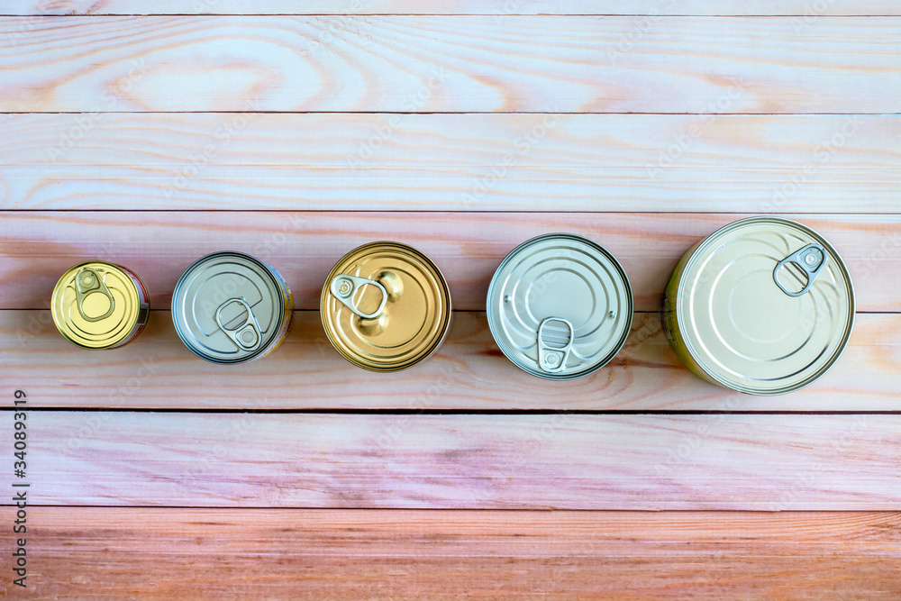 Overhead view row canned food in different sizes and colors. Stock non ...