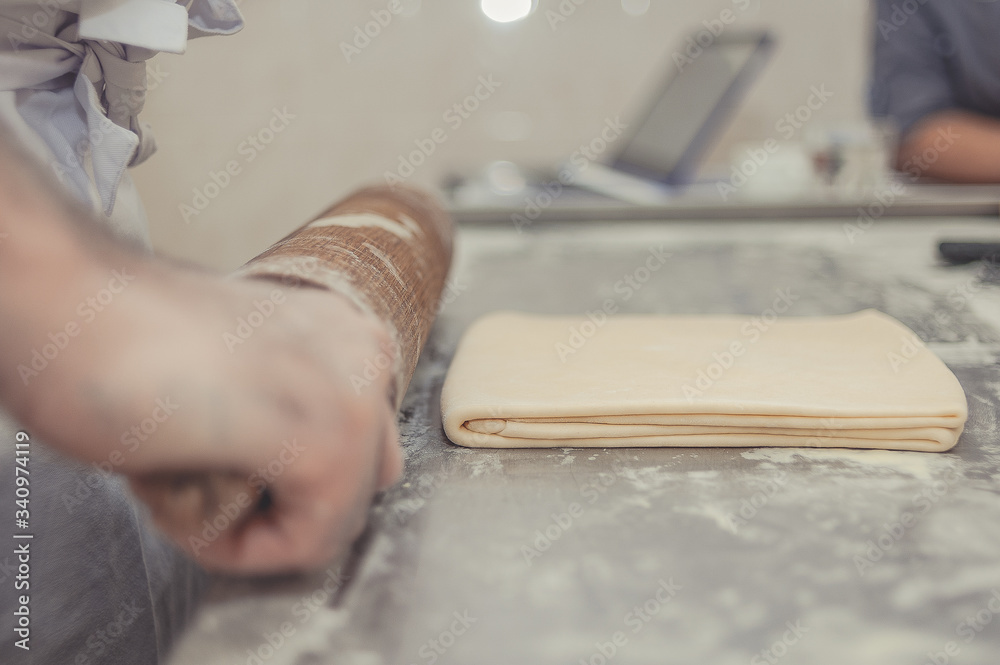 The process of preparing puff pastry in a bakery. Stock Photo | Adobe Stock