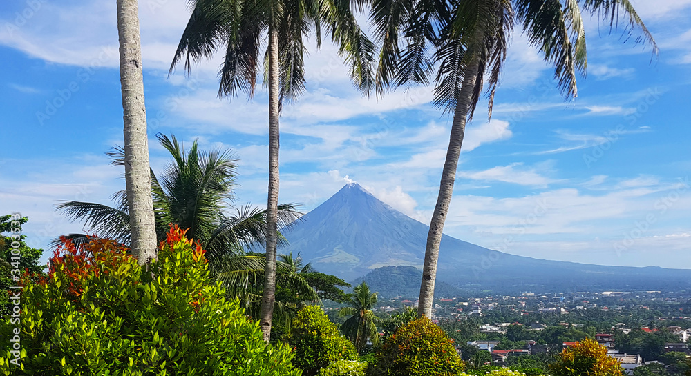 volcano with trees and blue sky Stock Photo | Adobe Stock