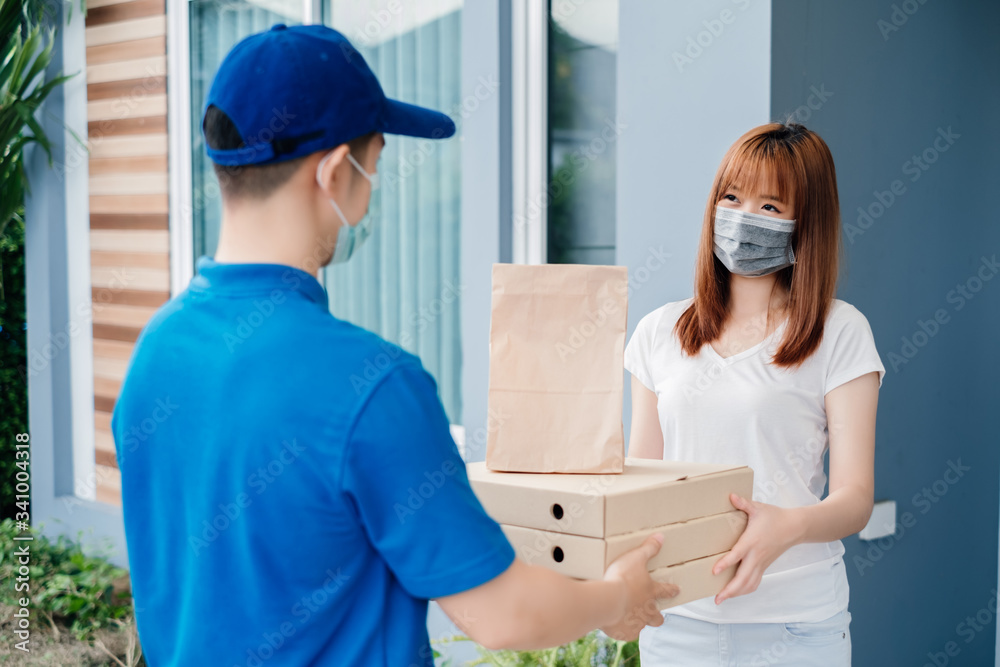Delivery express of asian woman picking food social distancing wearing ...