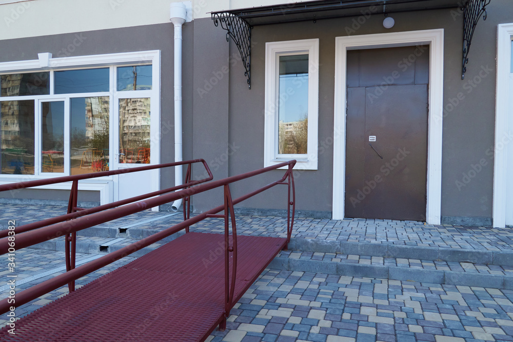 Wheelchair access ramp for entrance of residential multistory building ...