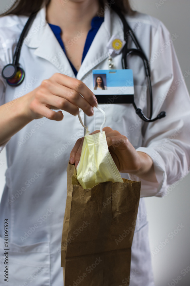 Bagging masks during coronavirus for reuse due to depleted PPE for ...