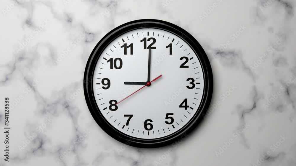 The Time On The Clock Nine. Black Clock With The Red Arrow With The ...