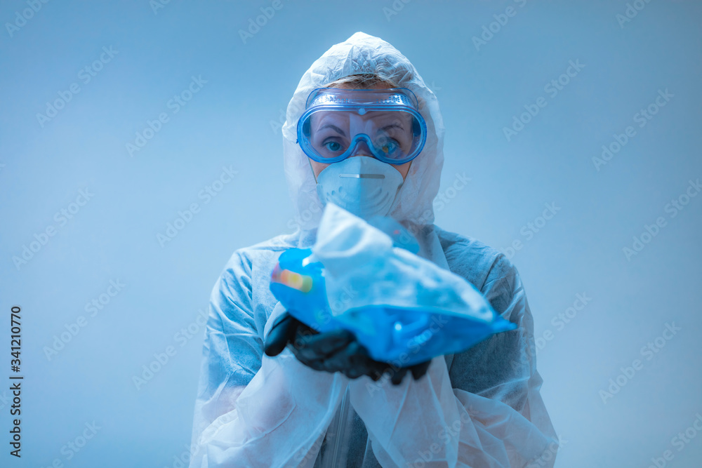 Medical doctor, scientist in full body suit for prevention from viruses ...