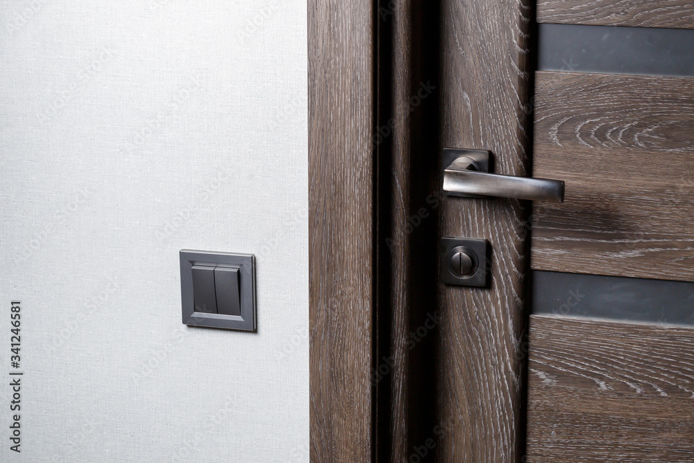 Two-key switch of gray color near the door, plastic mechanical switch ...