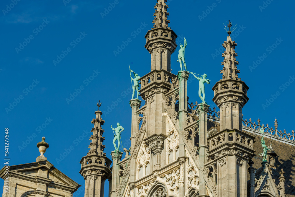 Statues on the roof of the Gothic Revival style Maison du Roi ...