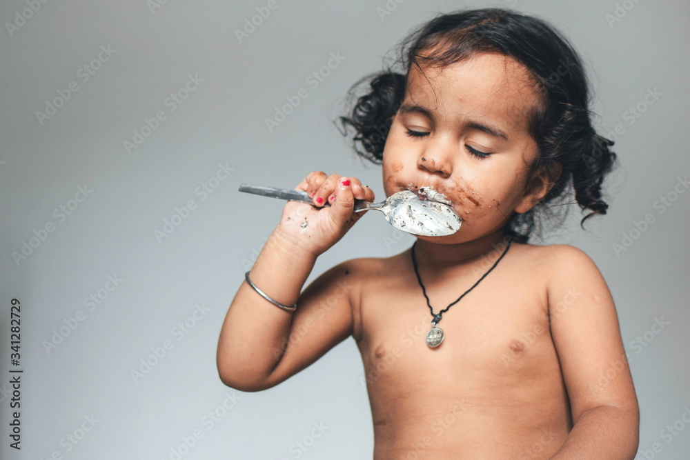 Portrait Of Shirtless Girl Eating Food Against Gray Background Stock ...
