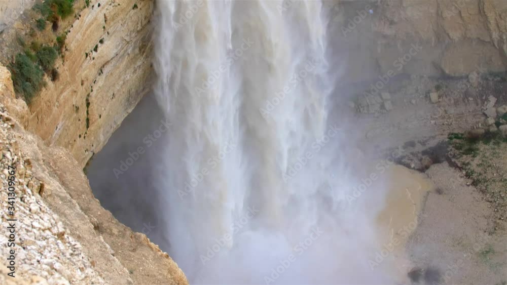 Giant waterfall, flash flood, Water falling into a pool in Wadi-Aerial ...