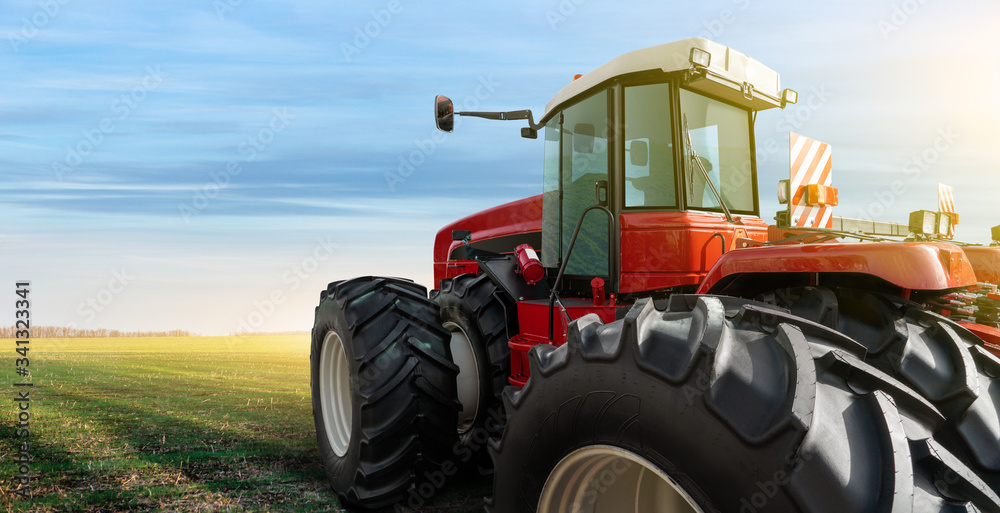 Back view of tractor on a agricultural field Stock Photo | Adobe Stock