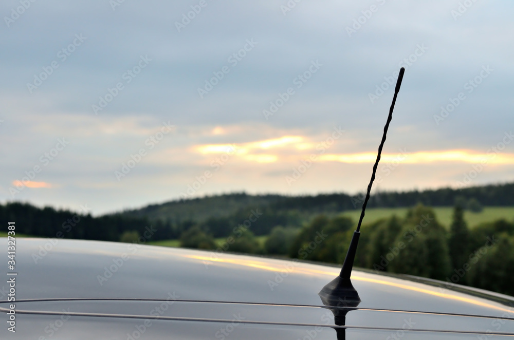 Car roof of modern black SUV crossover vehicle in nature and car radio ...