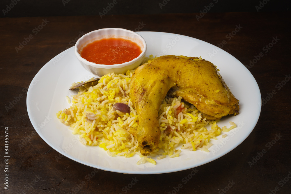 arabic chicken mandi rice on wooden dine table Stock Photo | Adobe Stock