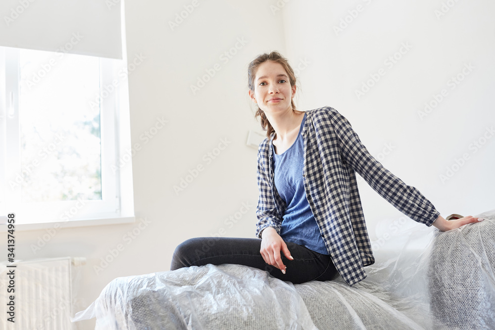 Woman relocating sits in the new apartment Stock Photo | Adobe Stock
