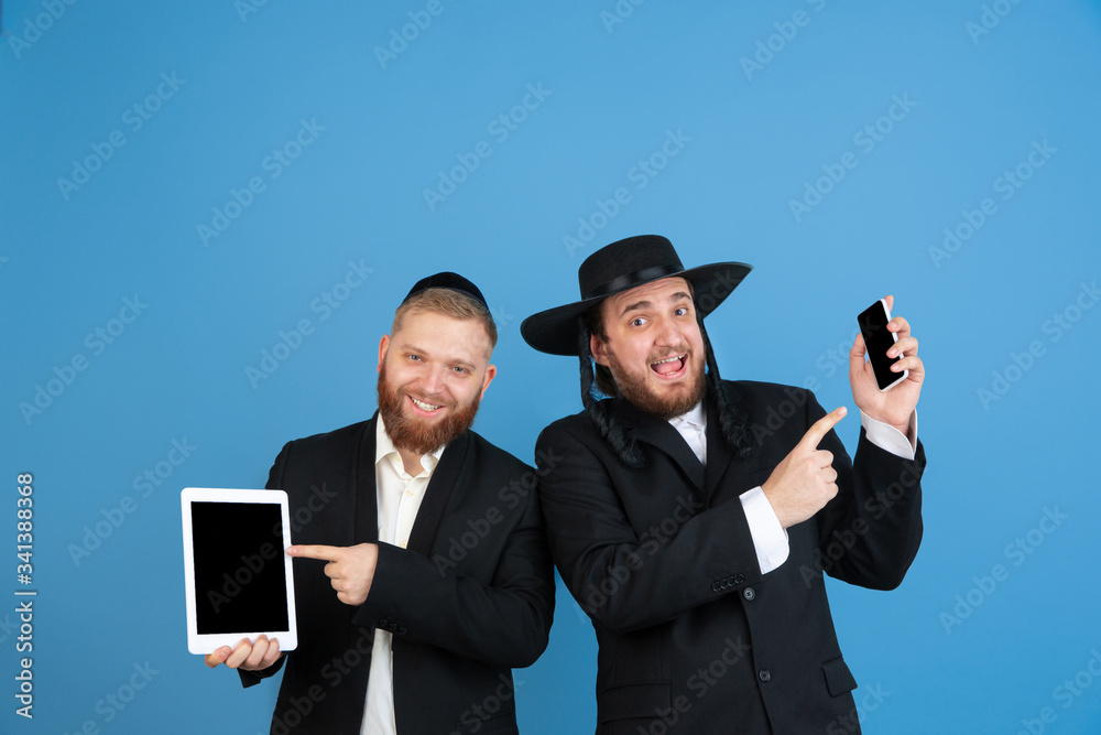 Showing blank devices screen. Portrait of a young orthodox jewish men ...