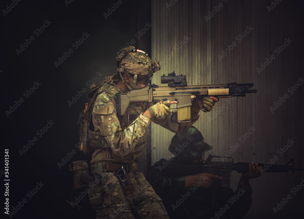 Special forces. soldier assault rifle with silencer. sniper in the ...