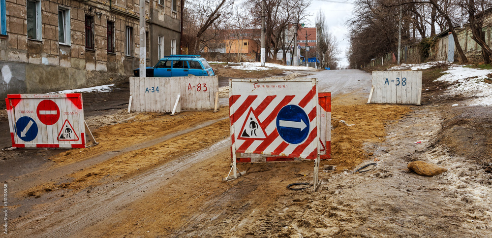 Renovation of the old road. Road Closed sign shows the direction of the ...