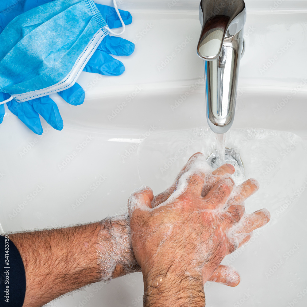 Coronavirus prevention. Hand washing with hot soapy water, the use of ...