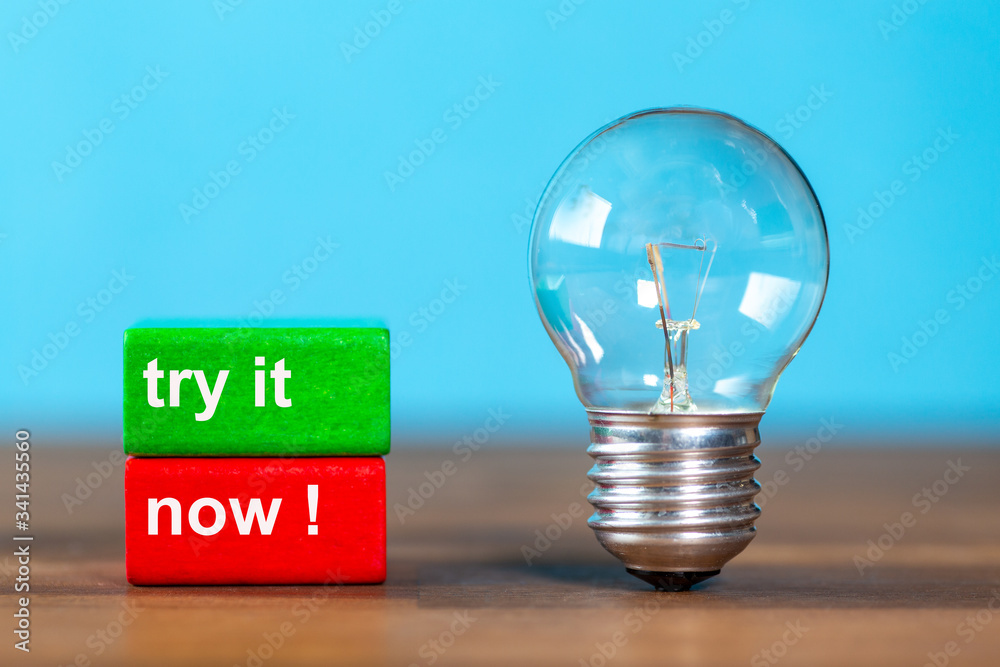 two blocks with the words try it now next to a free-standing antique ...