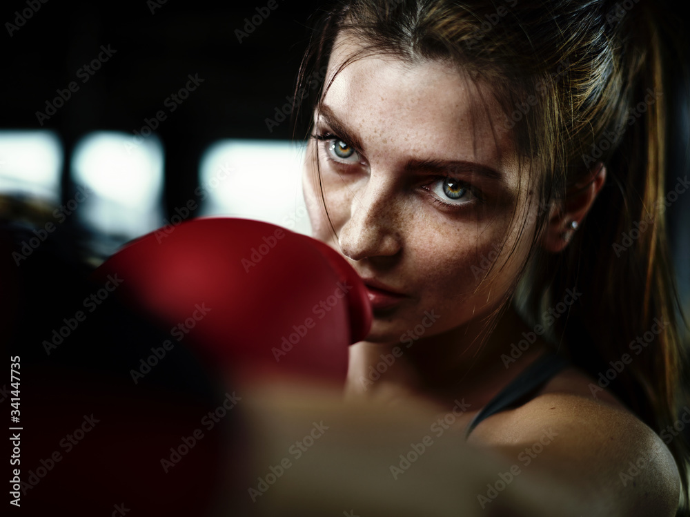 Fotka „Closeup portrait of attractive female boxer with freckles and ...