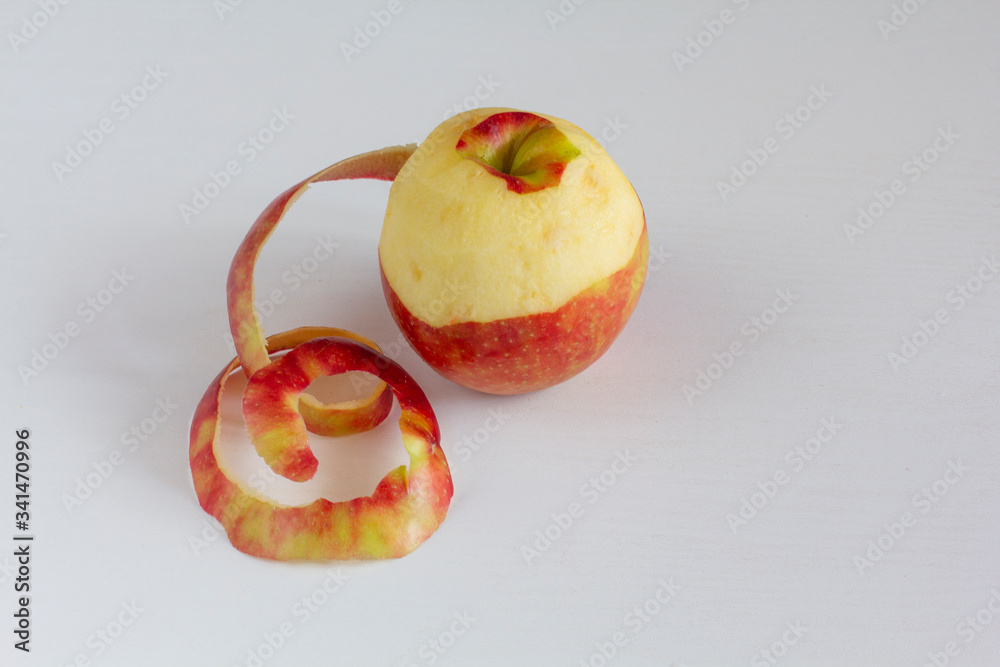 Apple peeling on a white background. Red Apple with peeled skin. Fresh ...